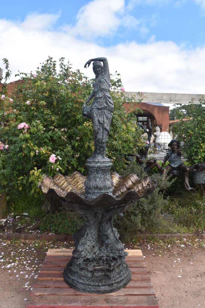 A large bronze fountain featuring a maiden with clam shell base. - The ...