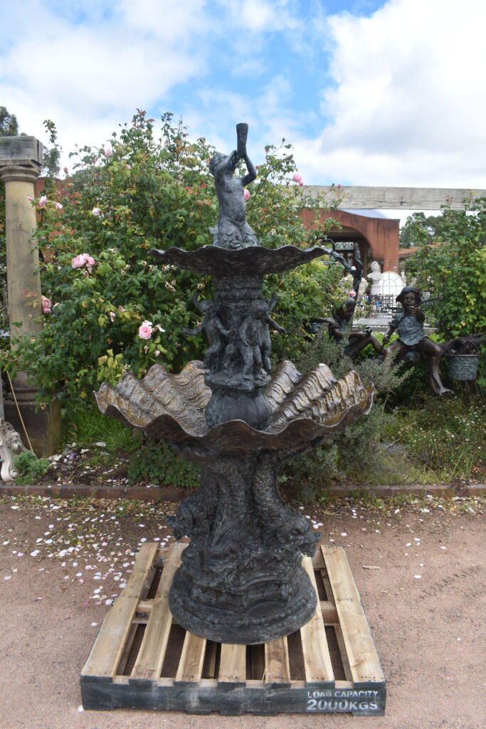 A large bronze fountain featuring a cherubs on clam shell base - The ...